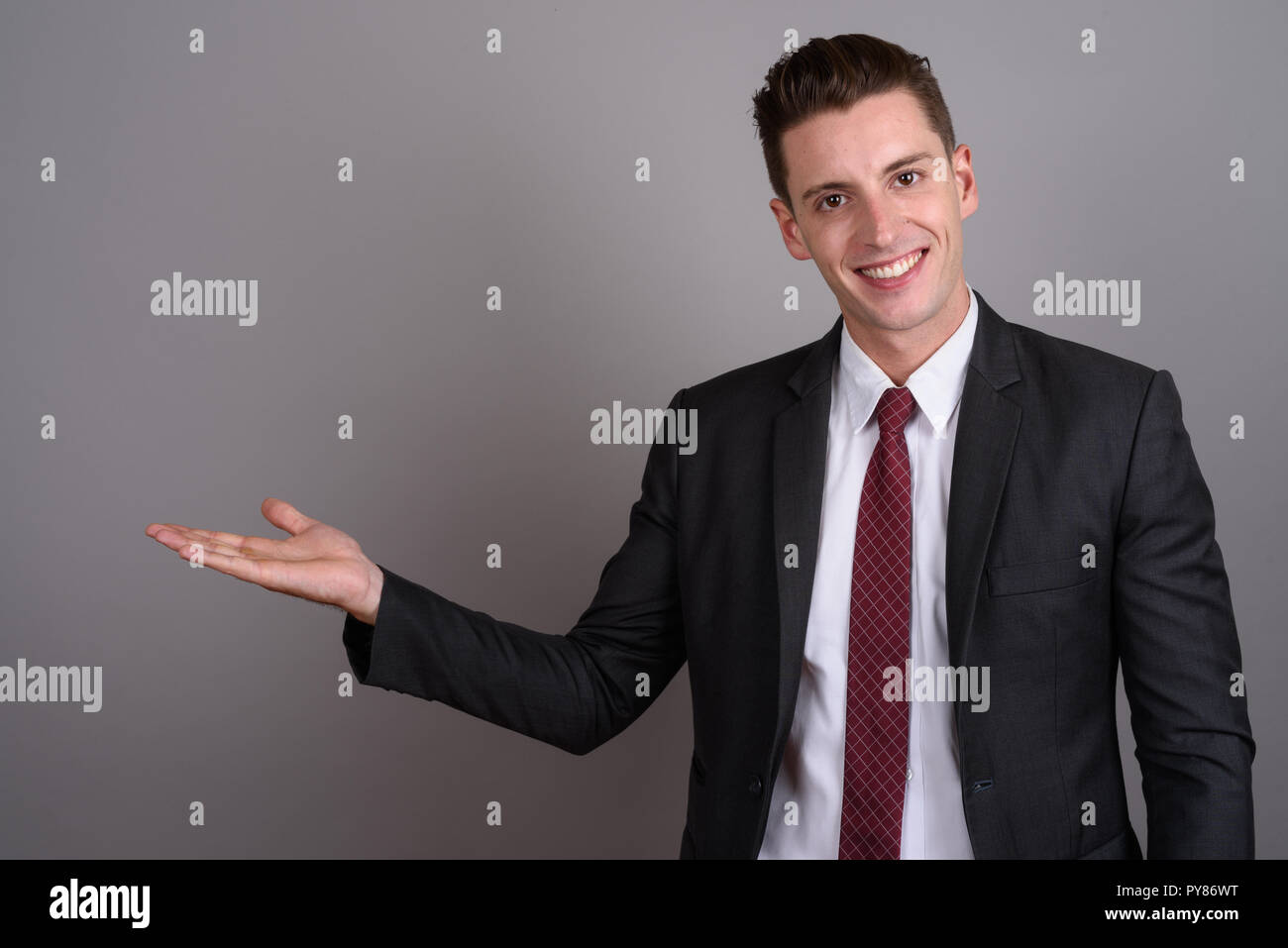 Smiling businessman showing copy hi-res stock photography and images ...
