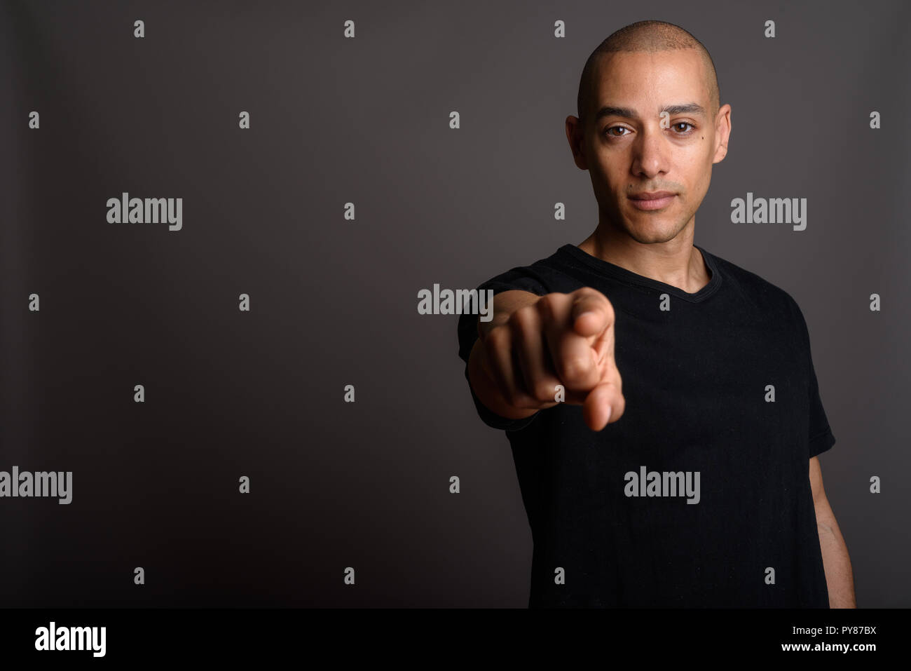 Handsome bald man pointing finger at camera Stock Photo - Alamy