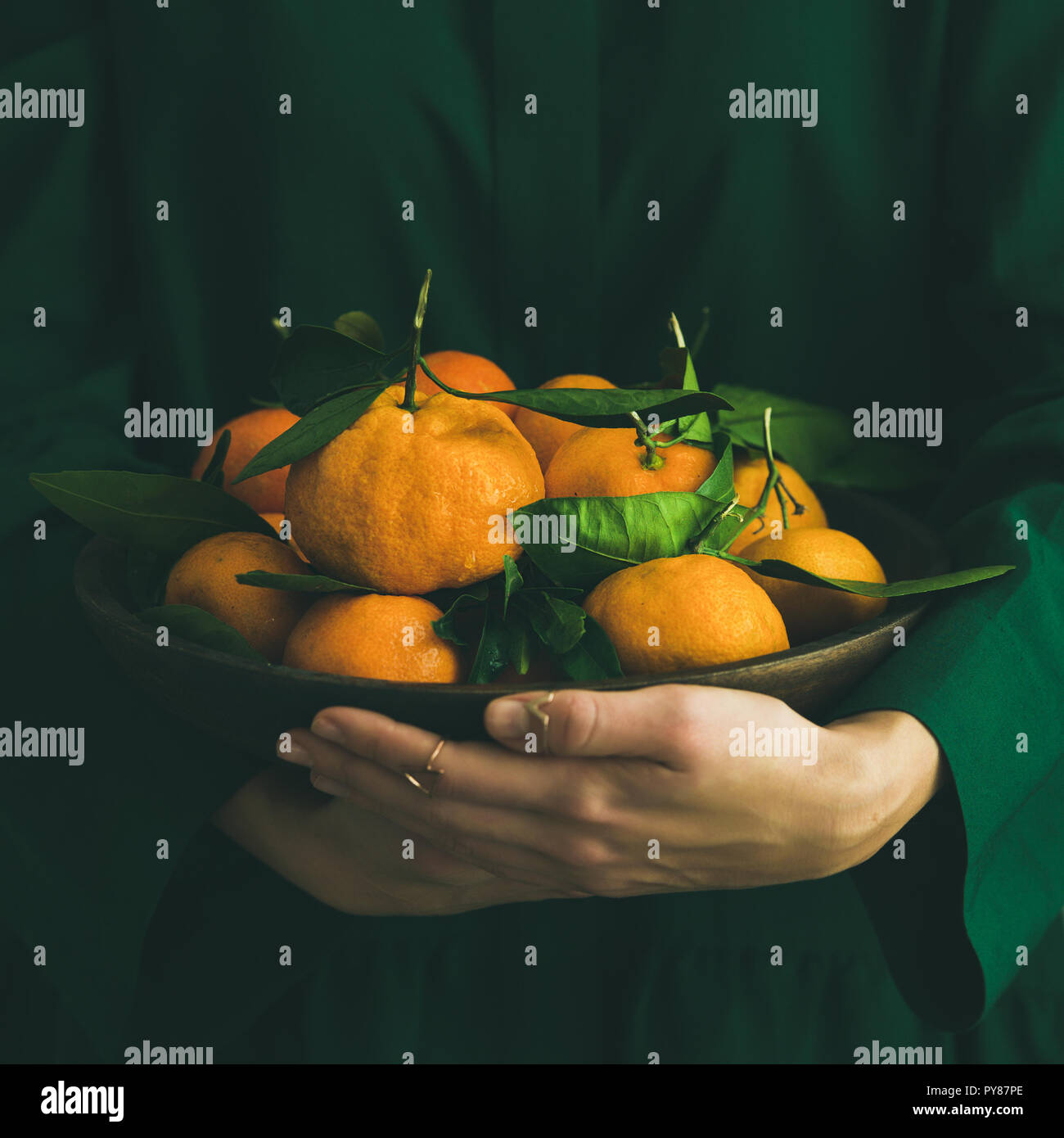 Fresh tangerine fruit with leaves in plate, square crop Stock Photo - Alamy
