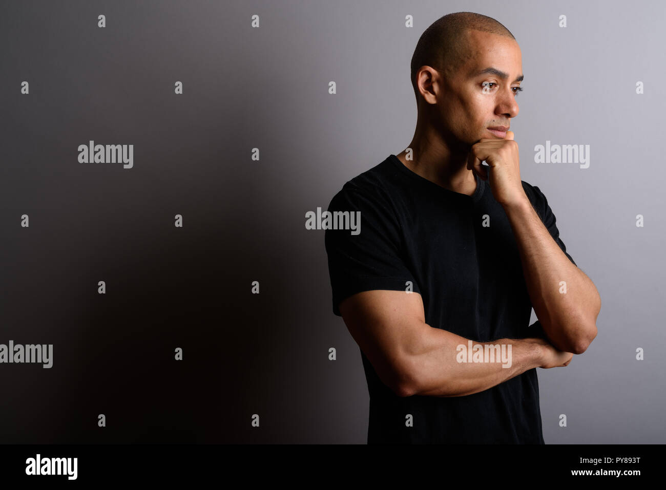 Stressed and sad bald man thinking and looking down Stock Photo - Alamy