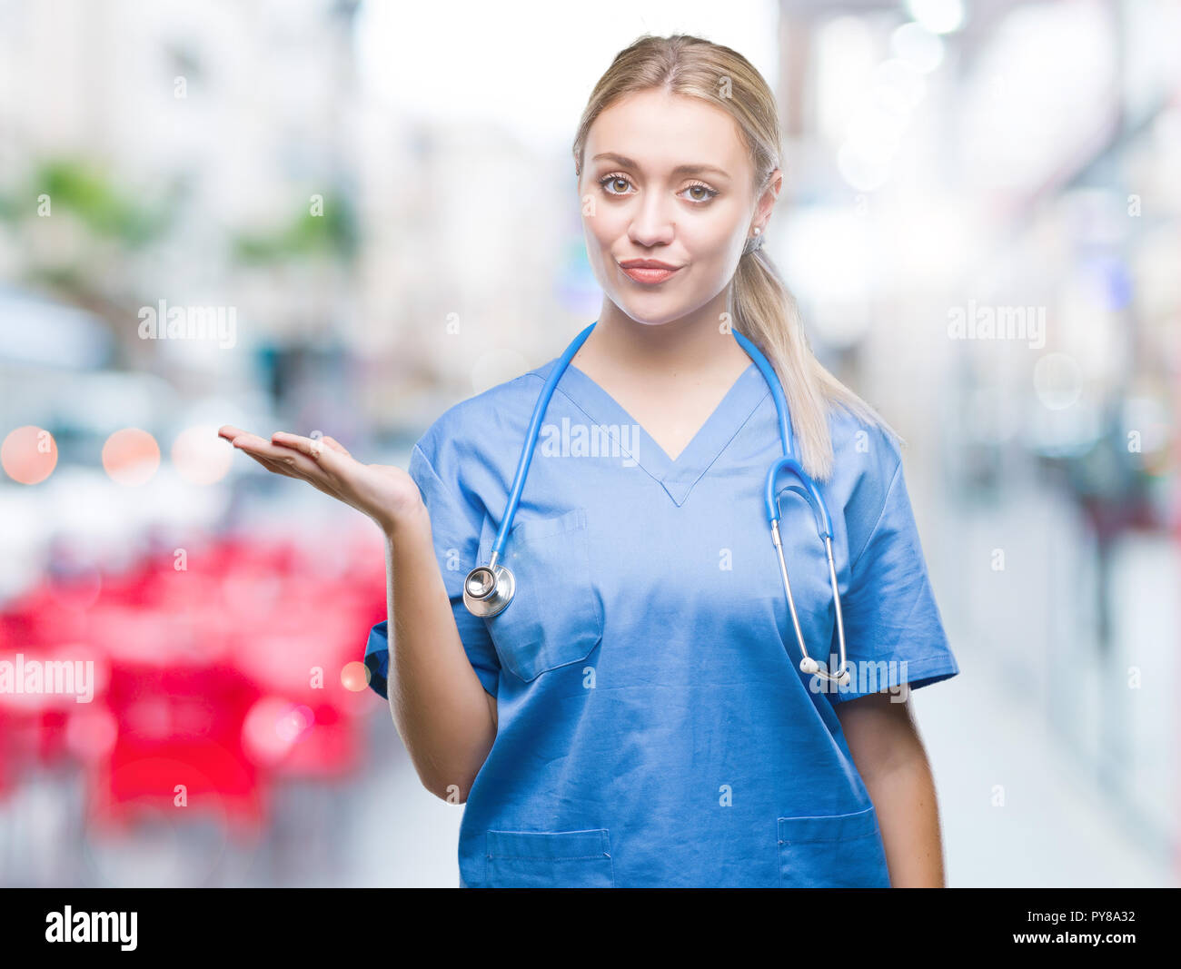 Young blonde surgeon doctor woman over isolated background smiling ...