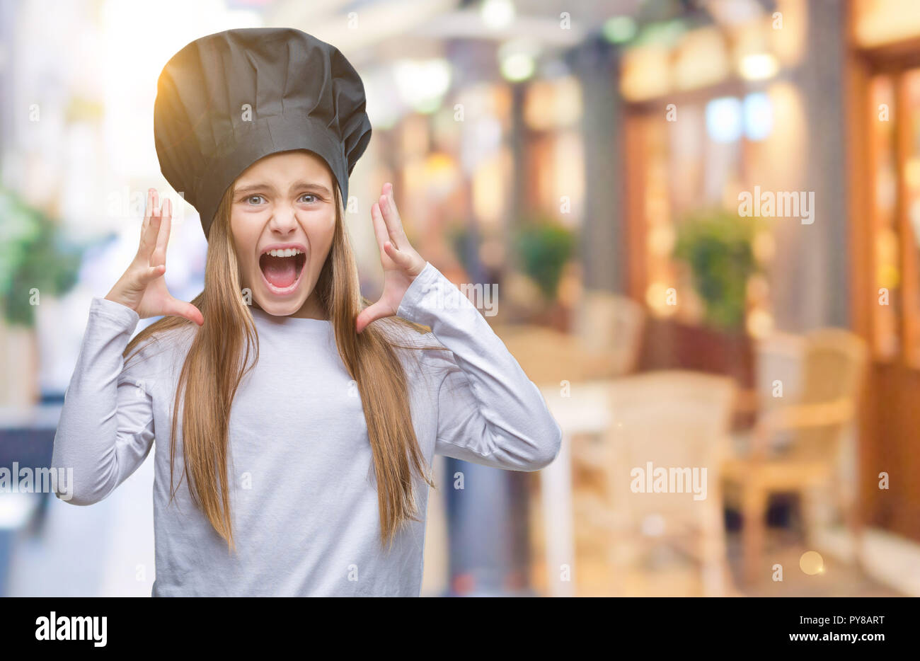 Young beautiful girl wearing chef hat uniform over isolated background ...