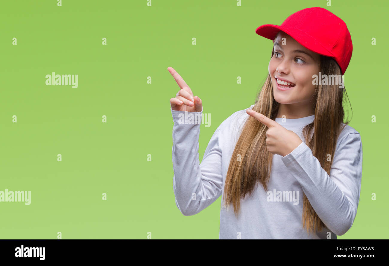 Young beautiful girl wearing red cap isolated background smiling and ...