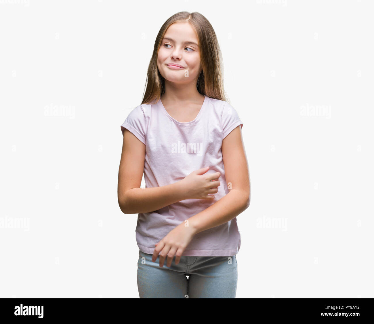 Young beautiful girl over isolated background smiling looking side and ...