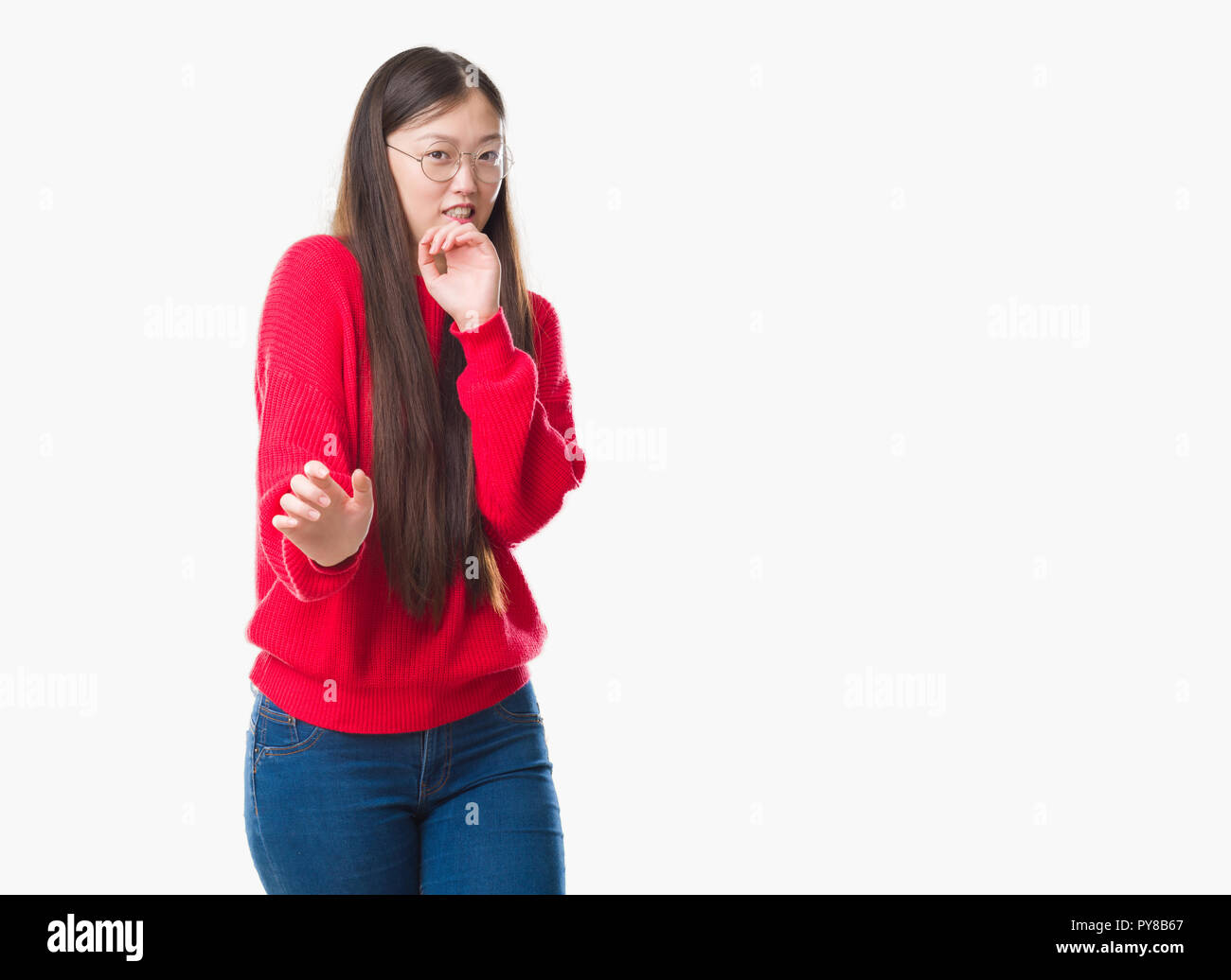 Young Chinese woman over isolated background wearing glasses disgusted ...