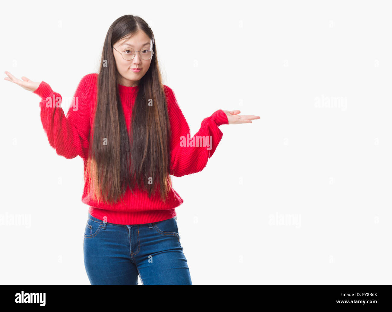 Young Chinese woman over isolated background wearing glasses clueless ...