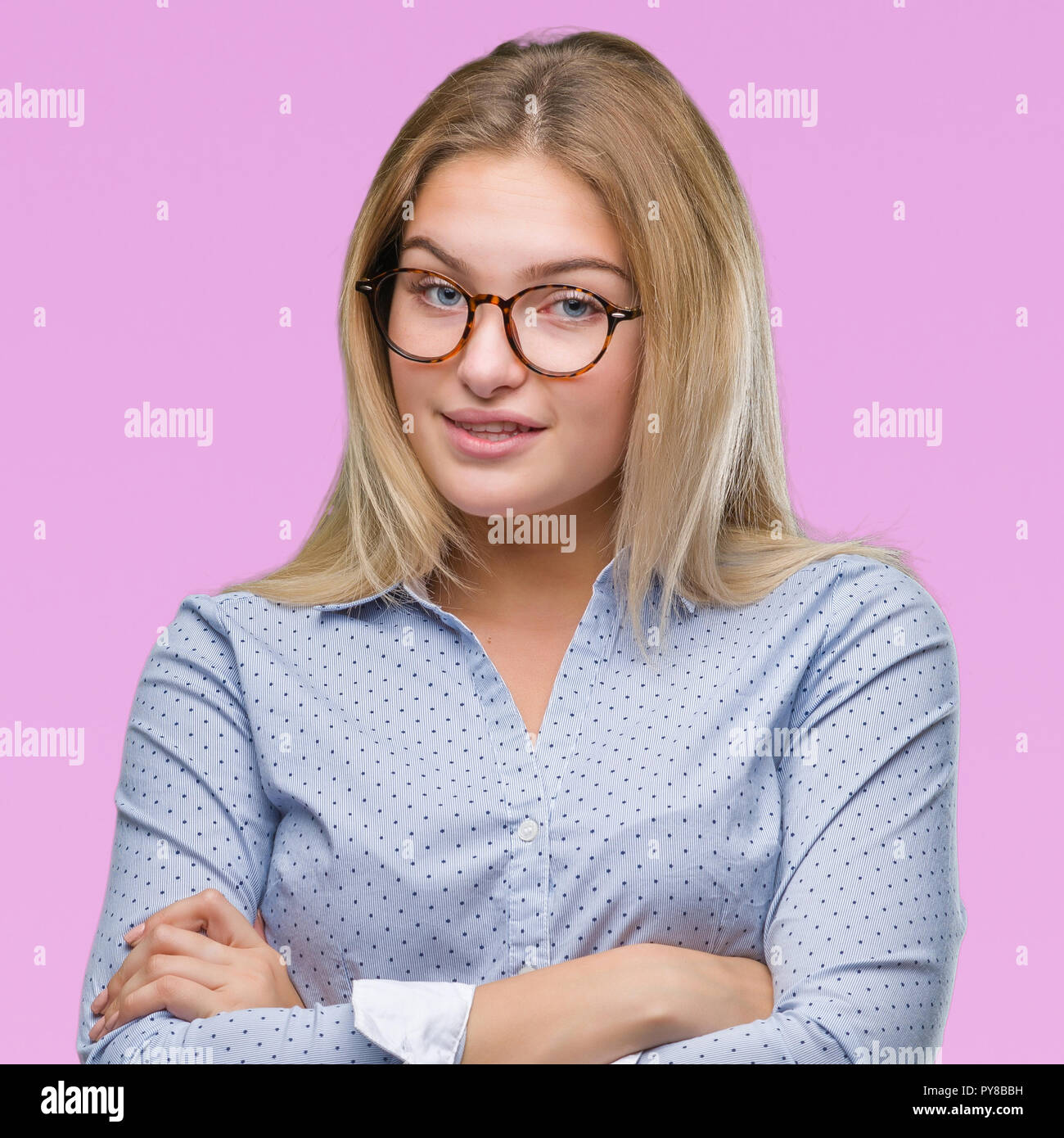 Young caucasian business woman wearing glasses over isolated background ...
