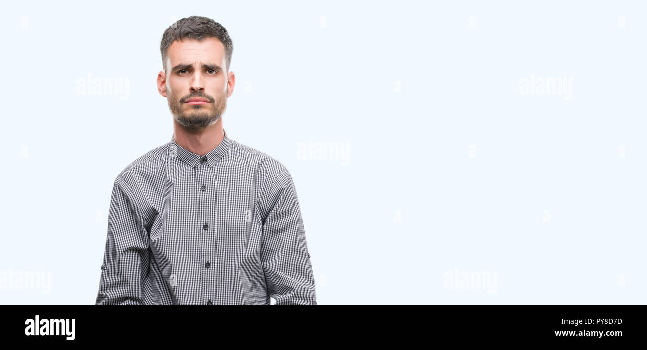 Young hipster man depressed and worry for distress, crying angry and ...