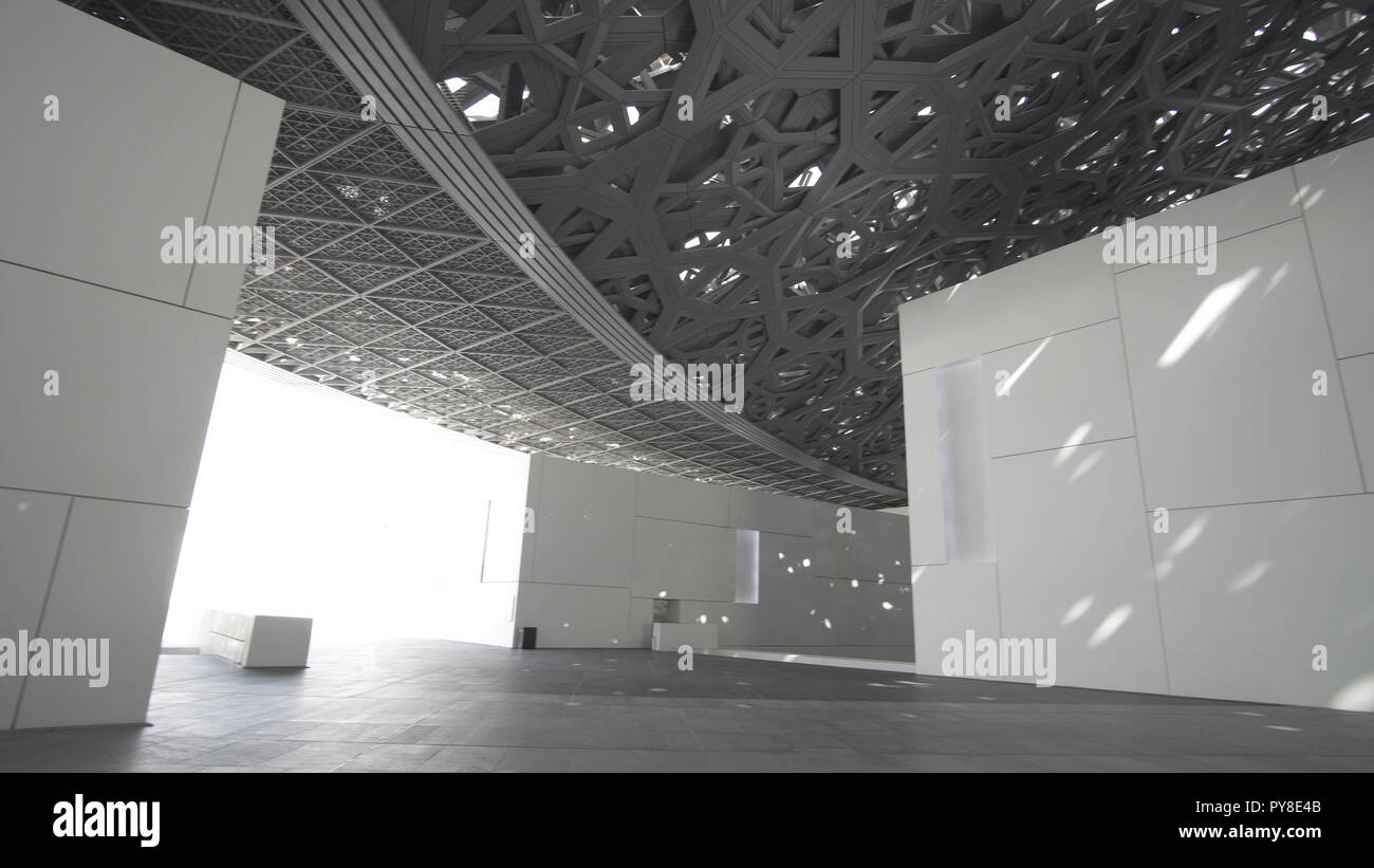 Interior of the new Louvre Museum in Abu Dhabi showing reflections of ...