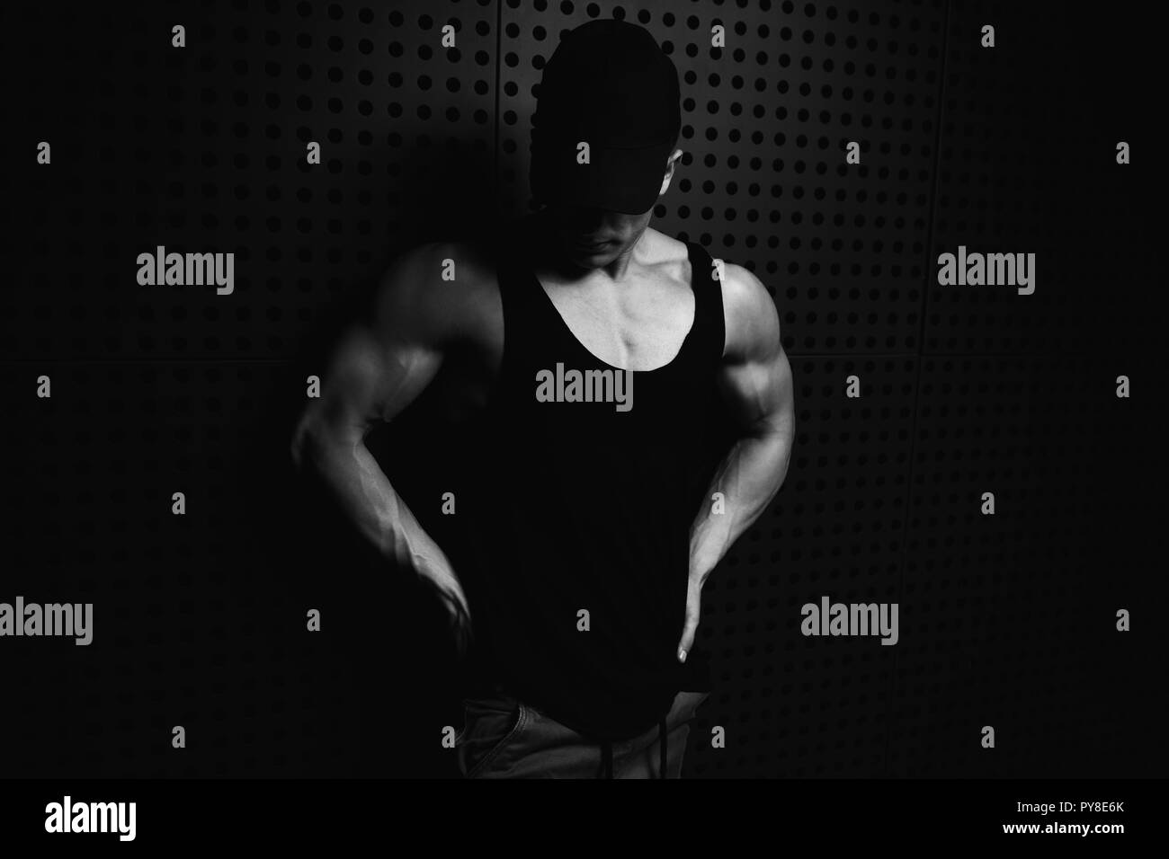 Healthy Young Man Standing Strong Standing Against a Wall and Flexing ...