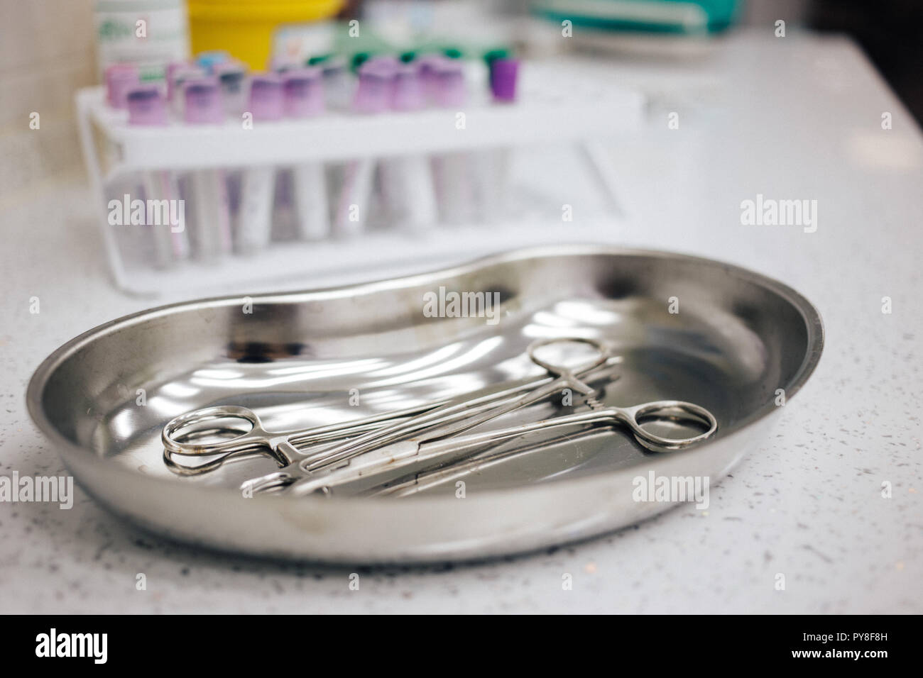 medical instruments in the tray, disposable gloves on the table. health ...