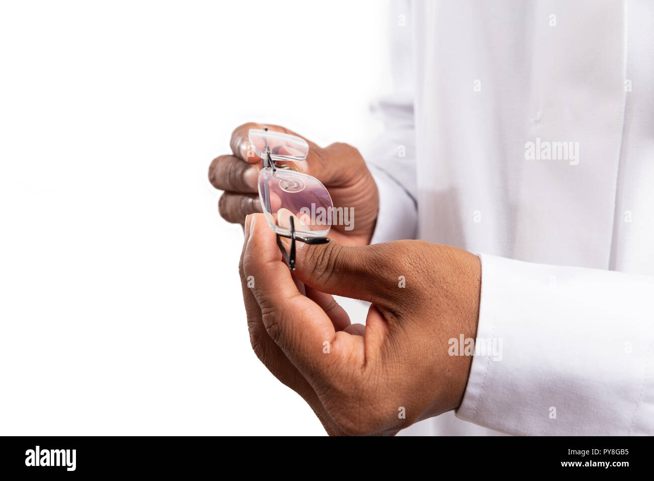 Close-up of spectacles or goggles held by optician medic as ...
