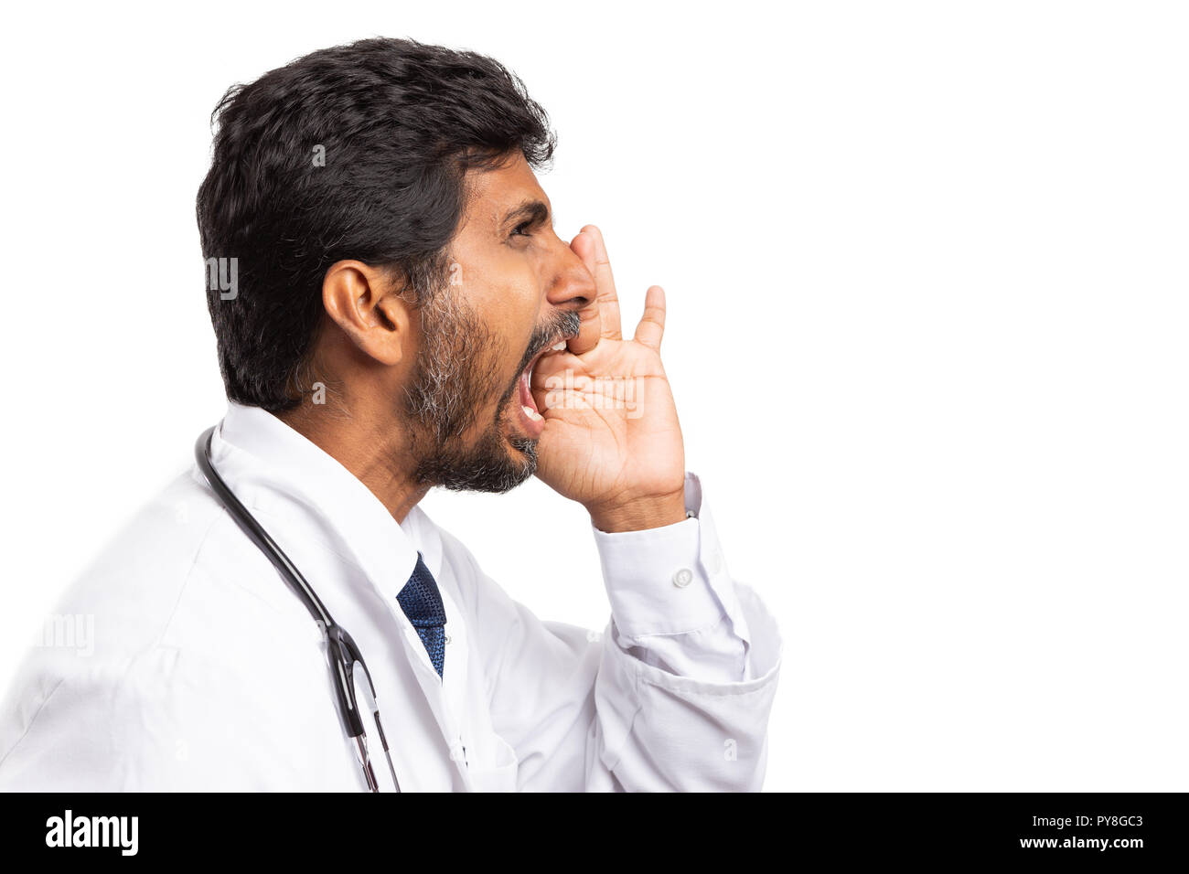 Isolated on white background side-view of indian doctor man shouting ...