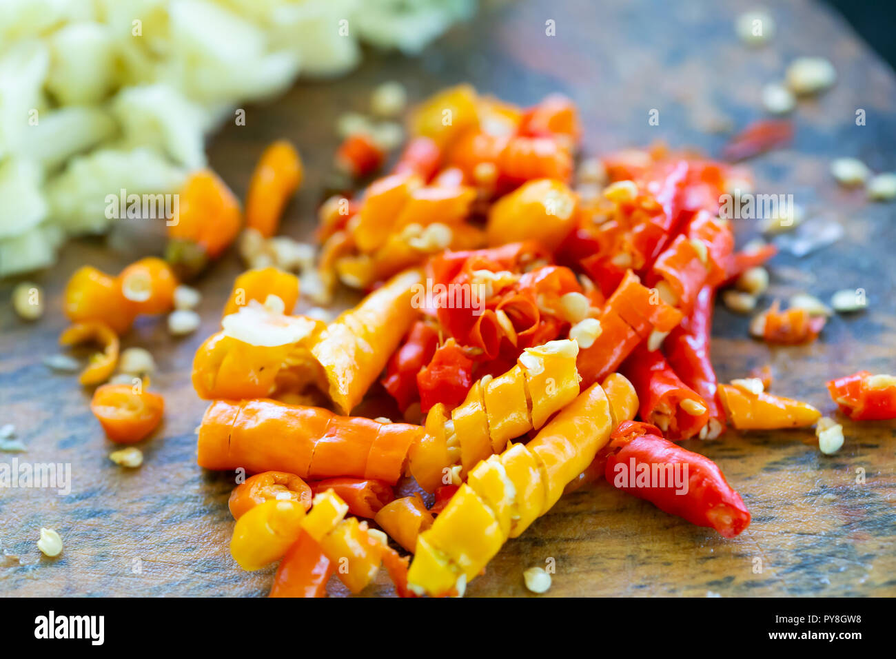 Fresh chilli is cut into pieces on the cutting board Stock Photo - Alamy