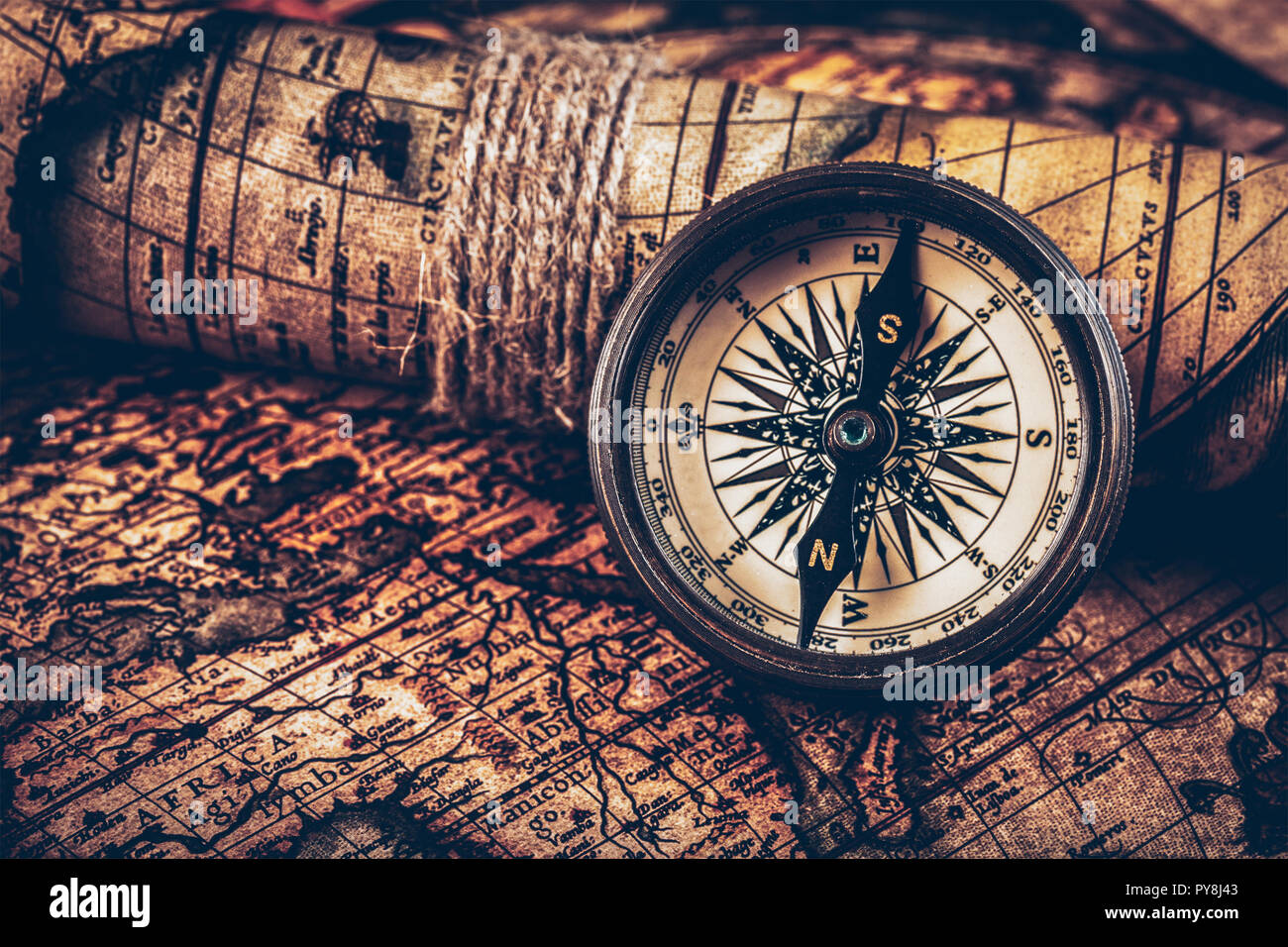 Antique brass compass on map hi-res stock photography and images - Alamy