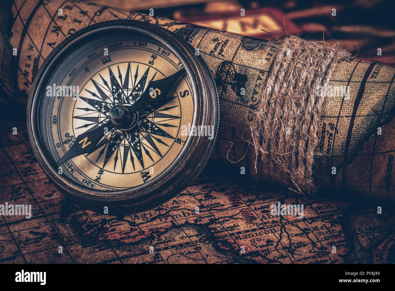 Antique brass compass on map hi-res stock photography and images - Alamy