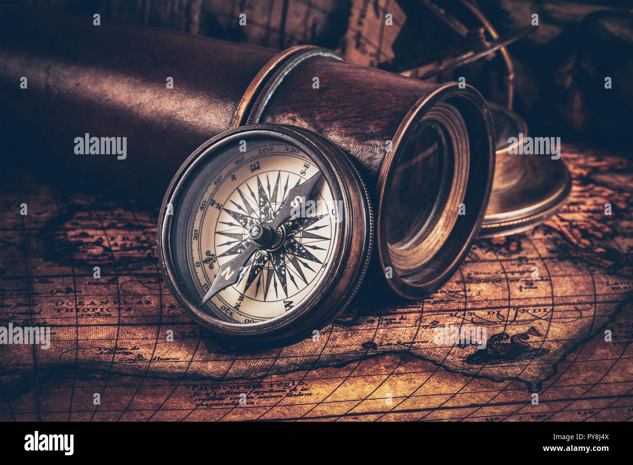 Old vintage compass on ancient map Stock Photo - Alamy