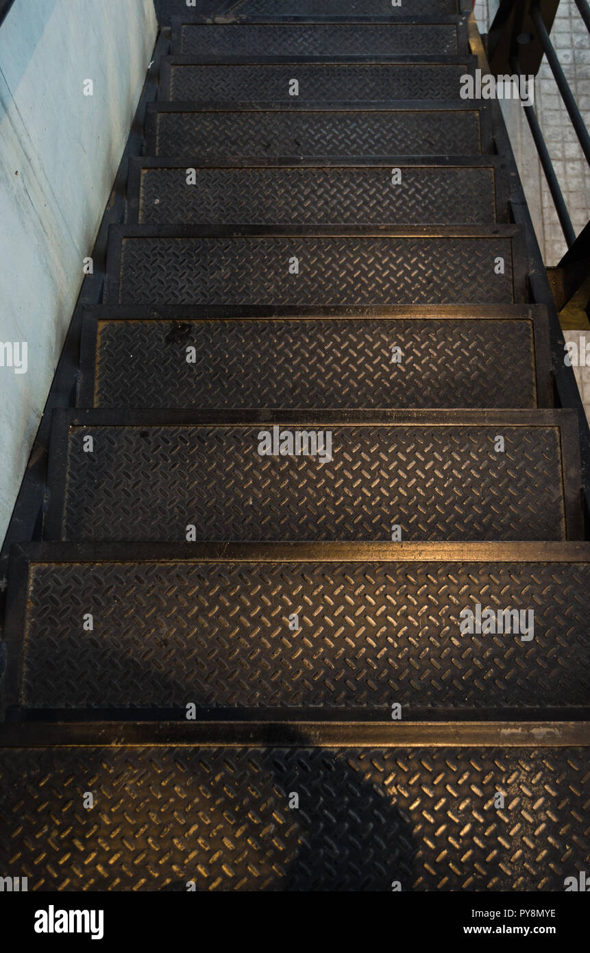 Pattern of metallic material black steps with a background of a city ...