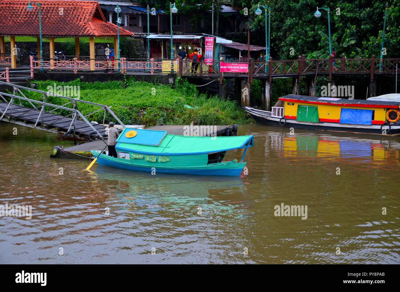 River crossing boat ferry parked at jetty station Sarawak River Kuching ...