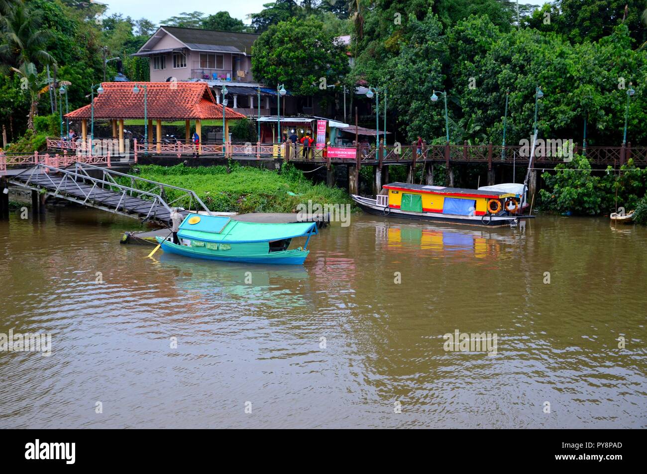 River crossing boat ferry parked at jetty station Sarawak River Kuching ...