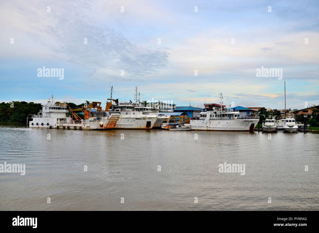 White marine ships & vessels moored at dock on Sarawak River Kuching ...