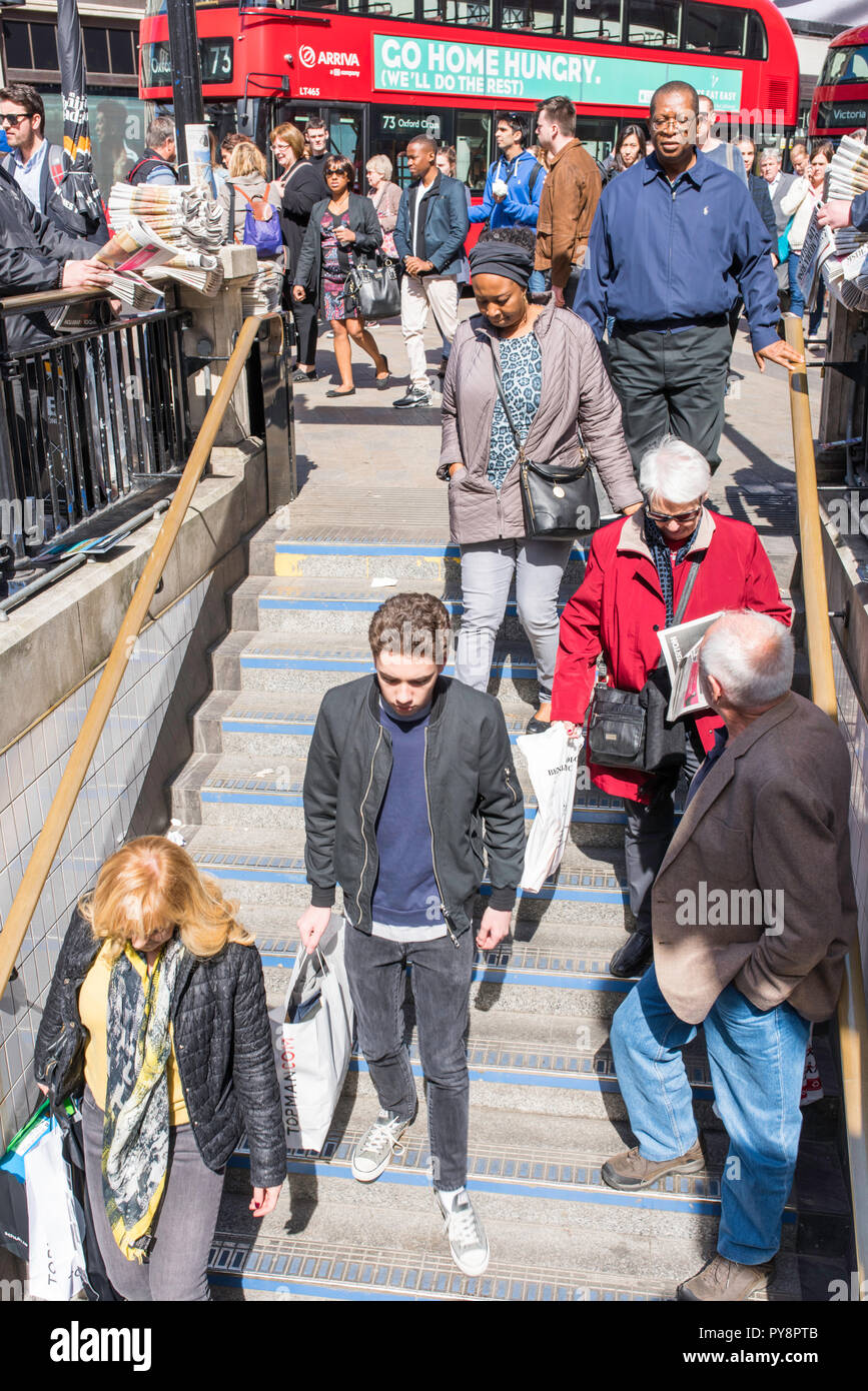 People walking down the steps to an underground station in London. A ...