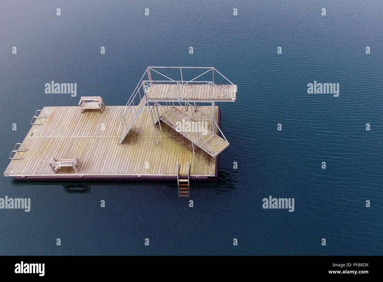 Wooden diving tower in the middle of the sea or lake. Aerial photograph ...
