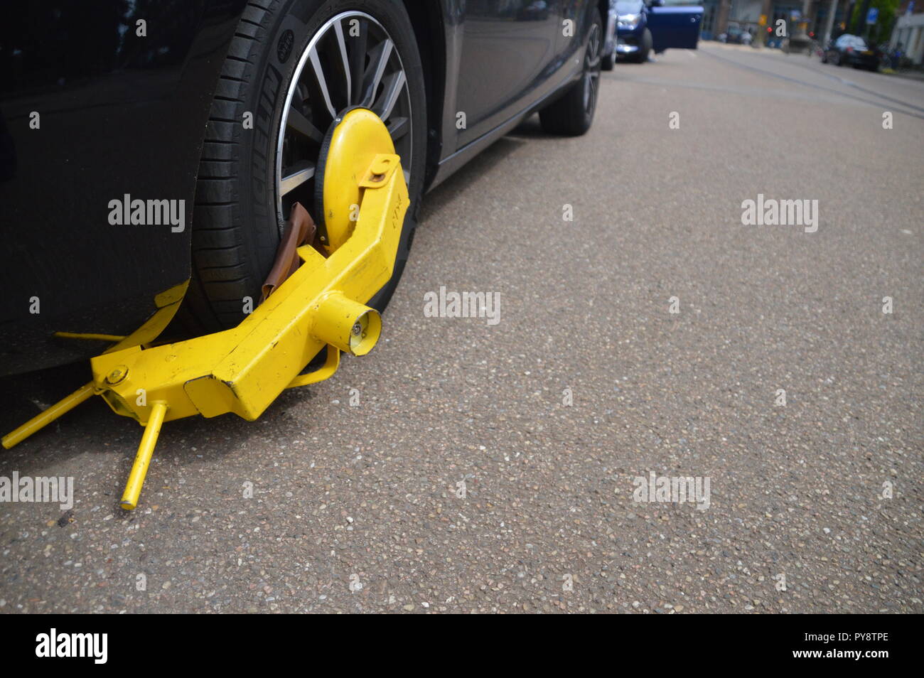 Car park wheel clamp hi-res stock photography and images - Alamy