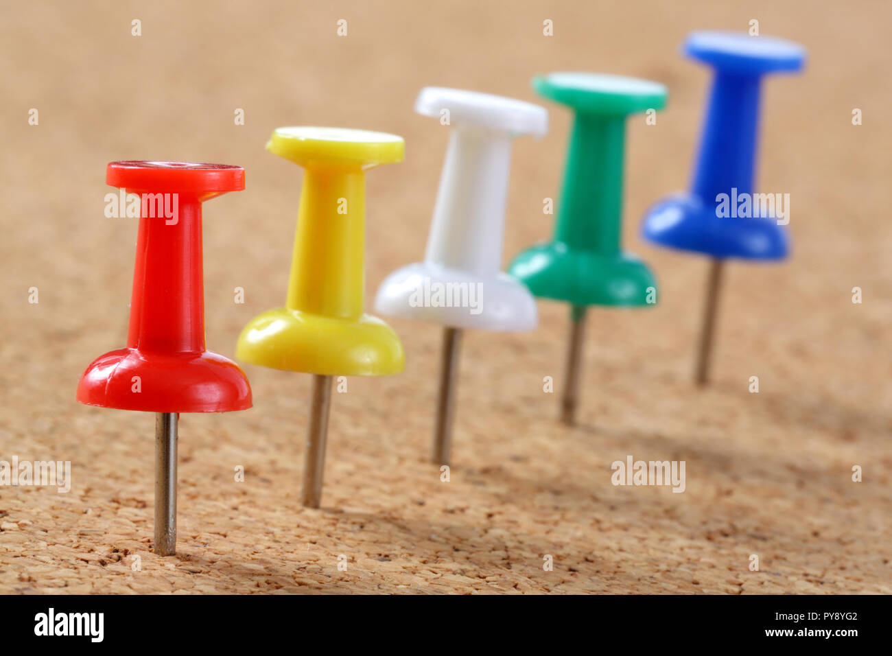 5 color pins on Cork board Stock Photo - Alamy