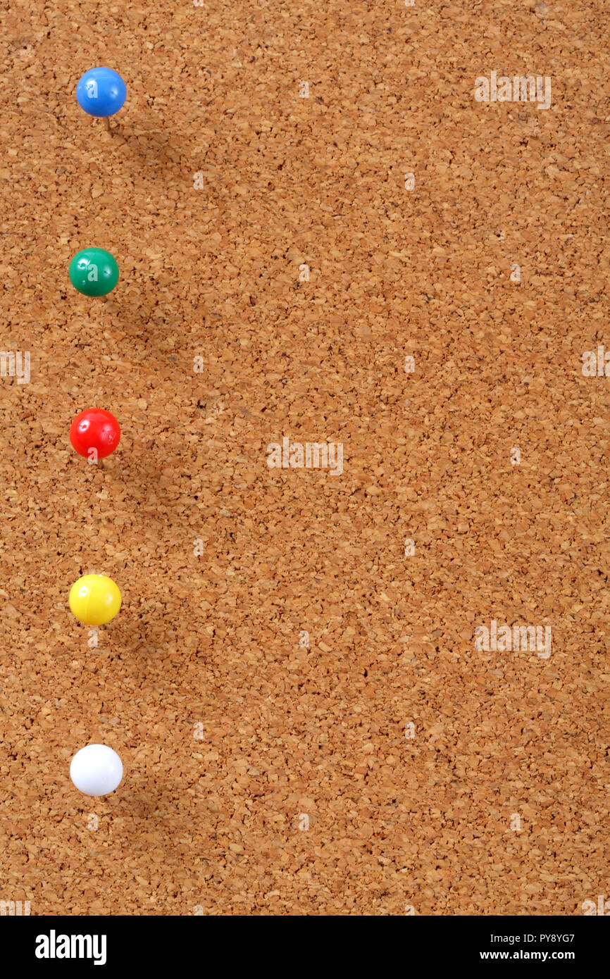 Cork board with pins bullets Stock Photo - Alamy