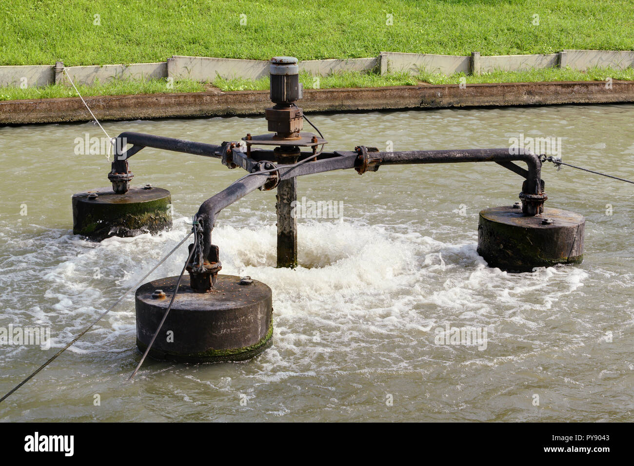 Water treatment by aerator Stock Photo - Alamy