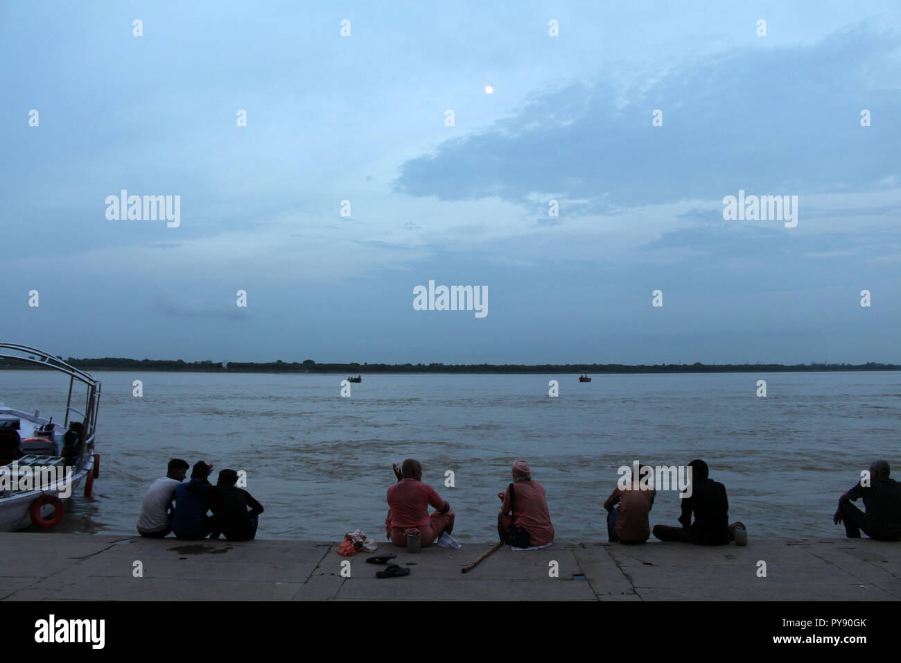 Local people chatting, interacting, hanging around Varanasi ghats in ...