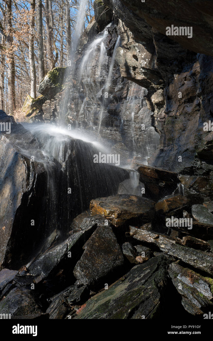 A waterfall is a place where water flows over a vertical drop or a ...