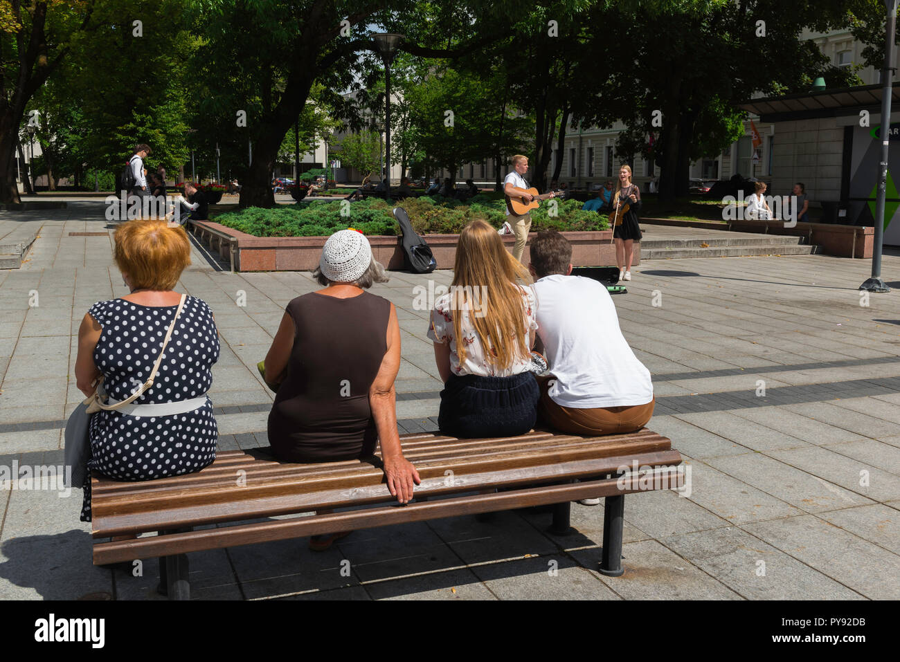 Person Sitting On A Bench From Back