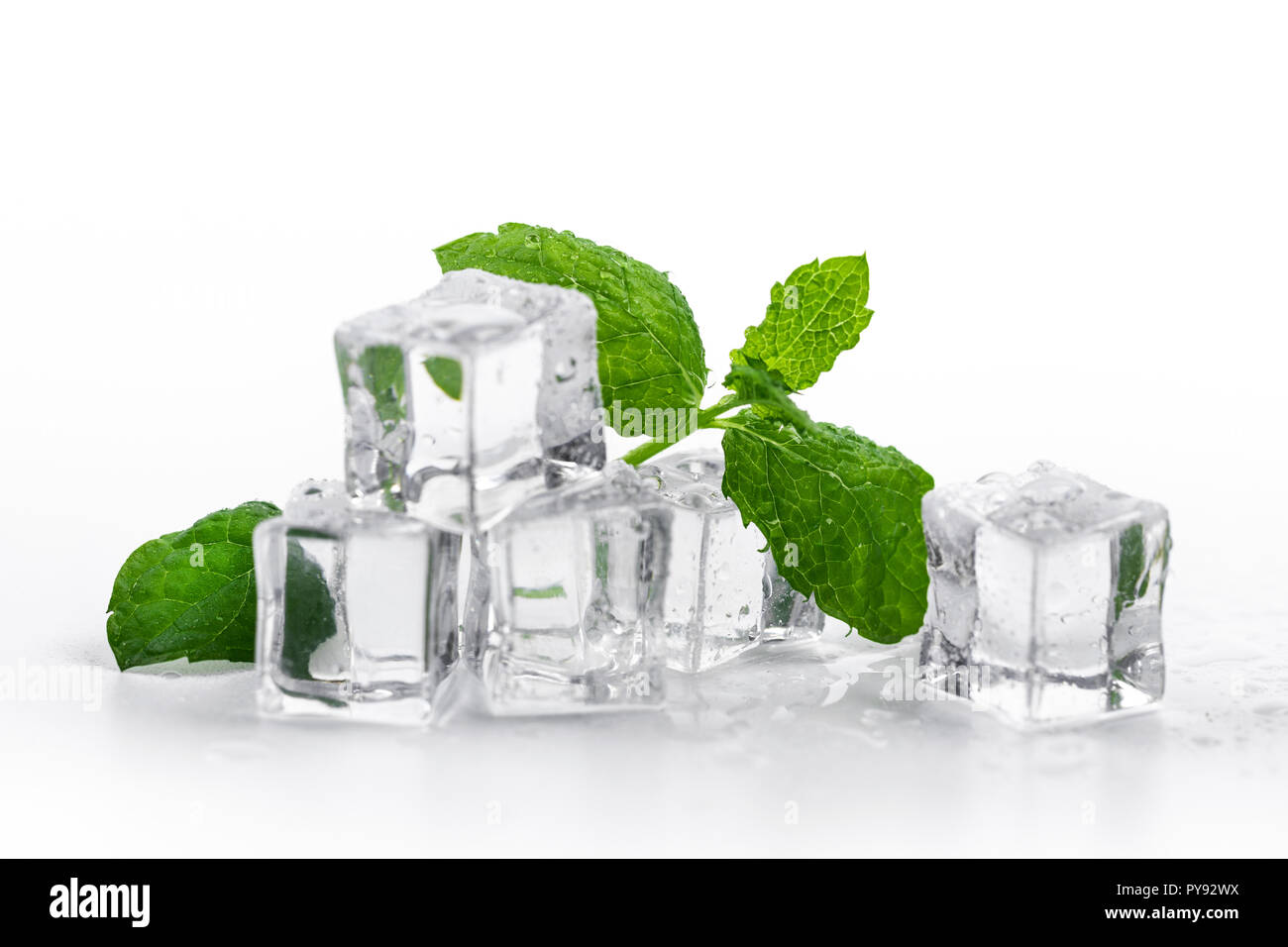 fresh mint and ice cubes on white background Stock Photo - Alamy