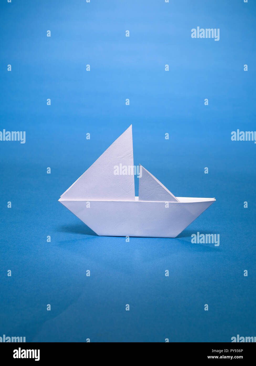 A STILL LIFE OF A PAPER SAIL BOAT MADE WITH THE ART OF ORIGAMI Stock ...