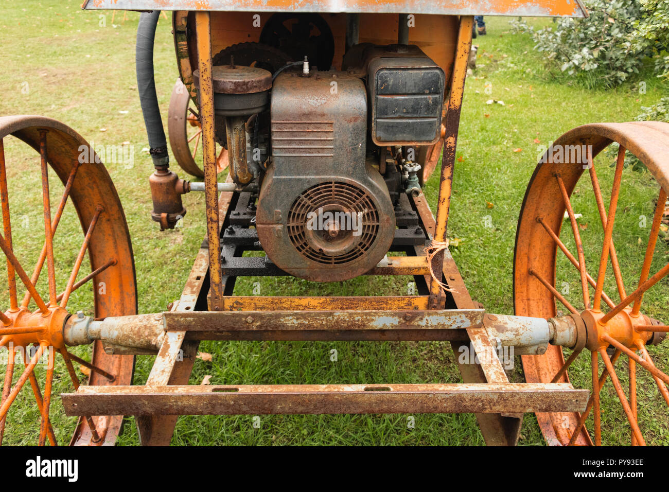 Ancient farm carriage, rusted motor and wheels - close-up detail Stock ...