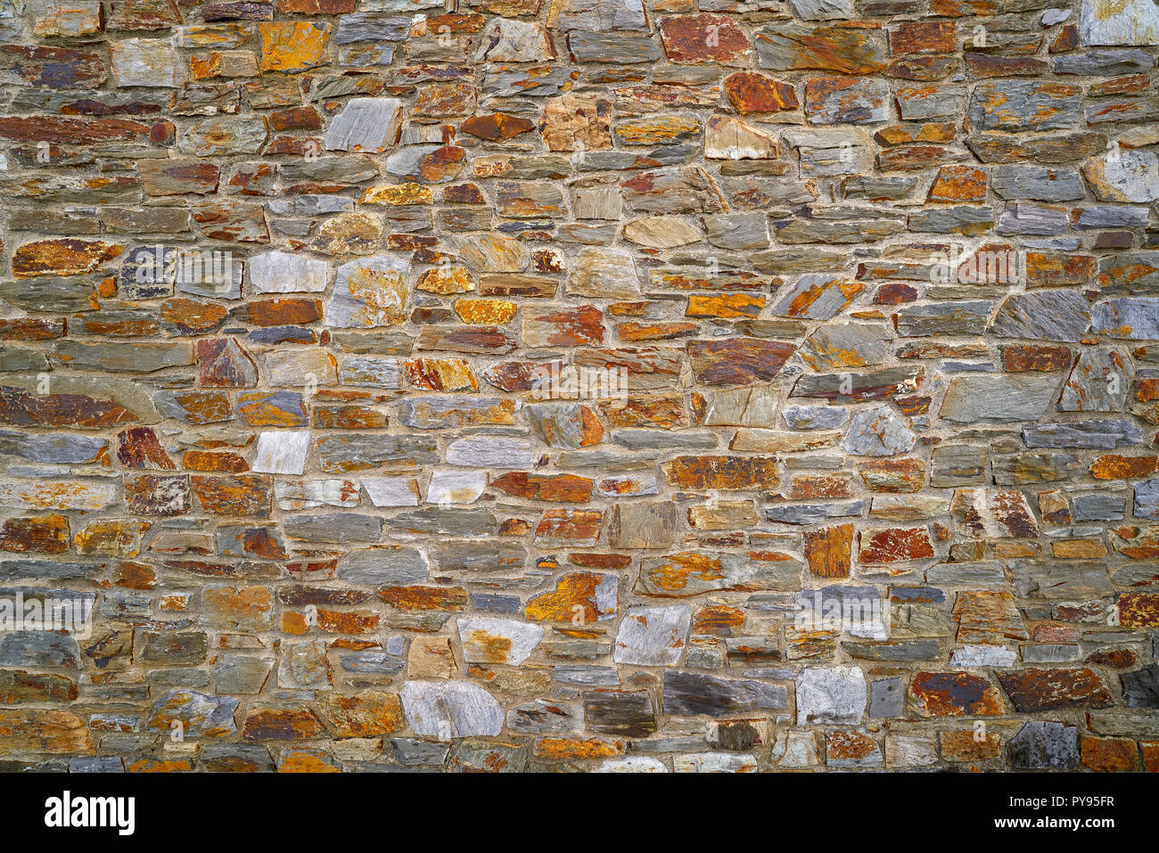 Slate stone masonry stone wall in Andorra Pyrenees Stock Photo - Alamy