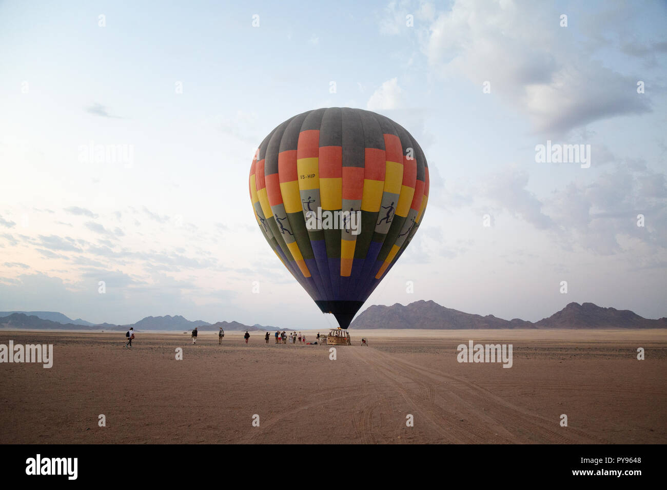 Africa tourism; hot air balloon ride for tourists at sunrise, the Namib ...