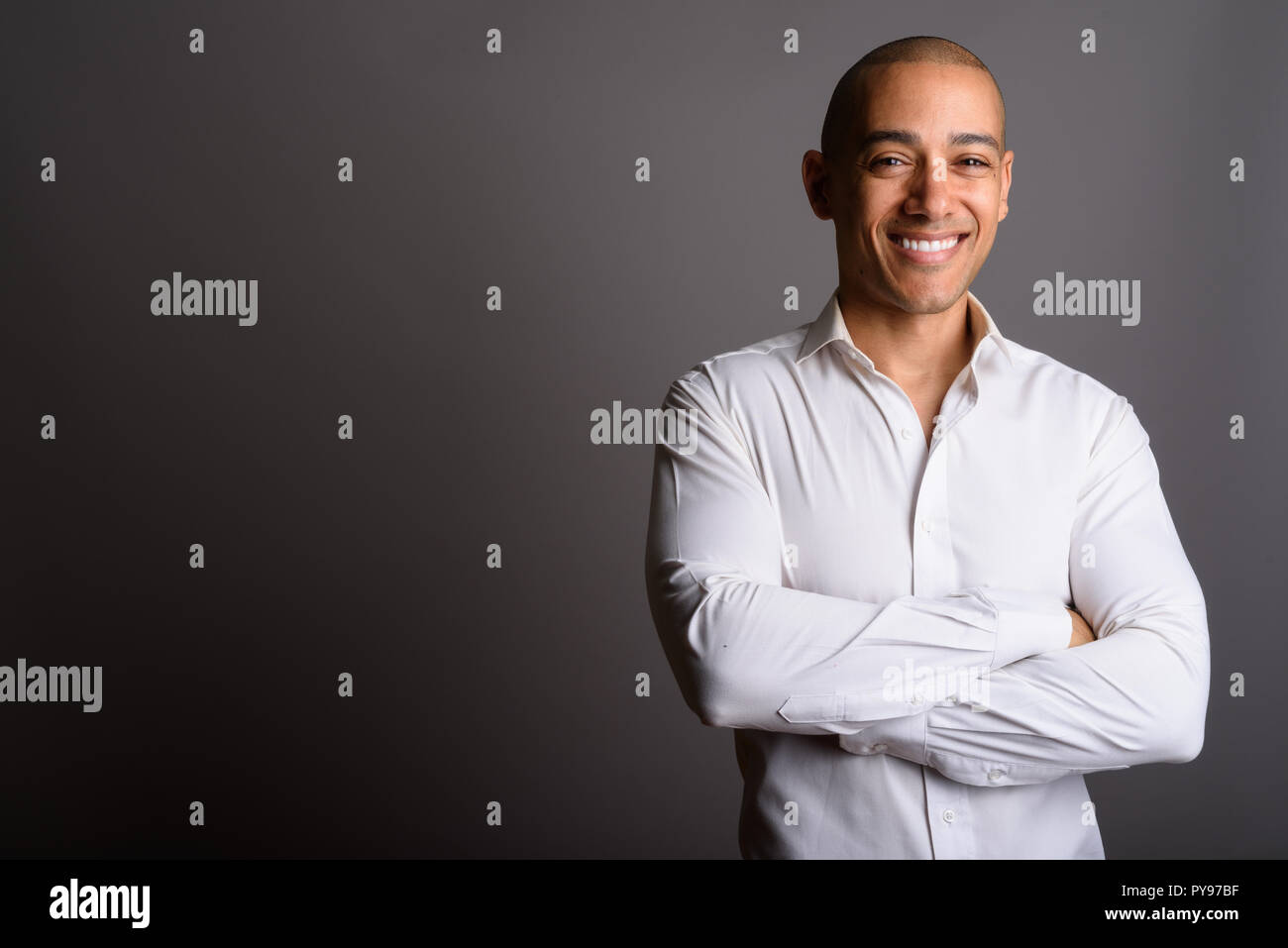 Handsome bald businessman smiling hi-res stock photography and images ...