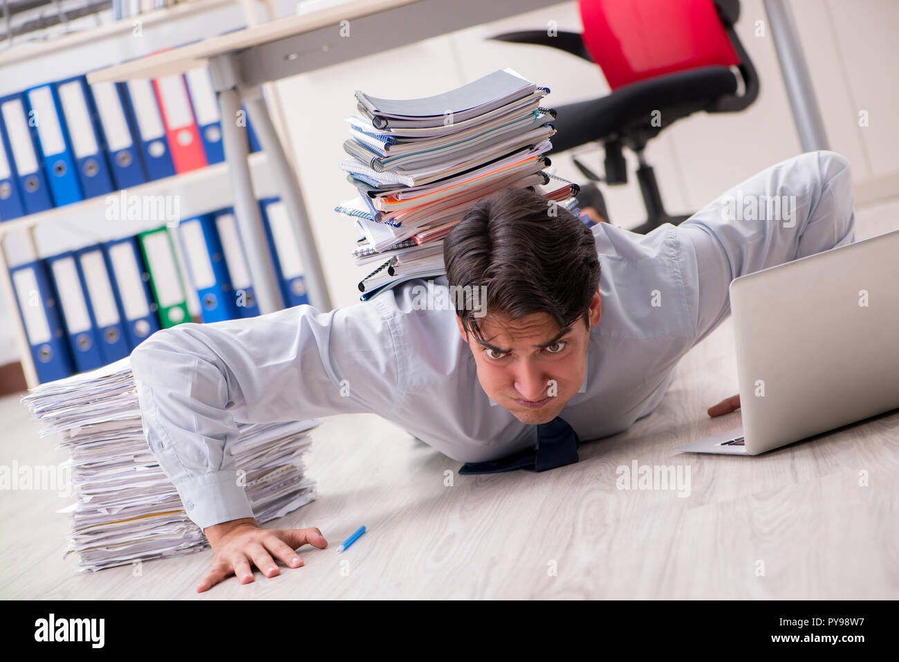 Extremely busy employee working in the office Stock Photo - Alamy