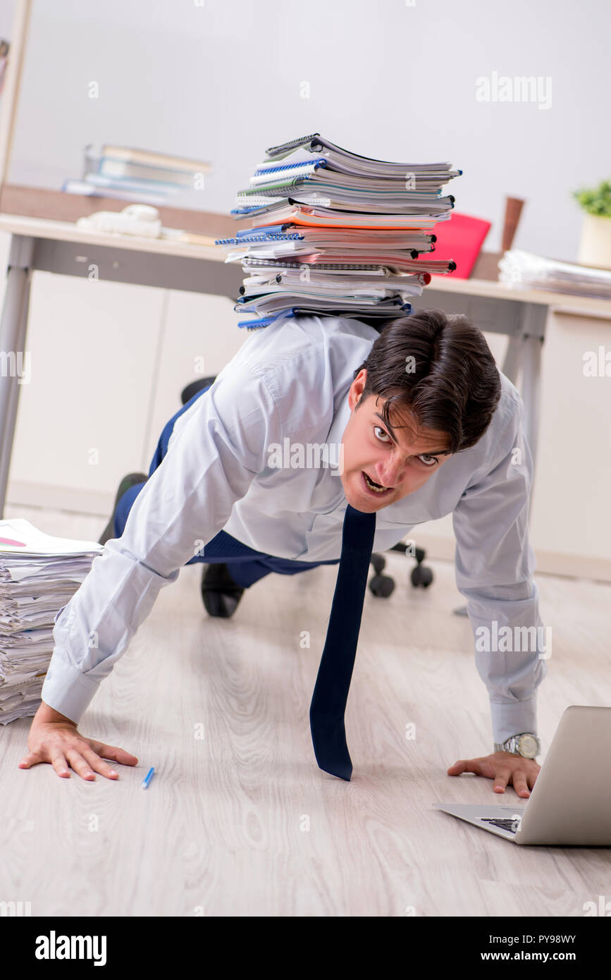 Extremely busy employee working in the office Stock Photo - Alamy