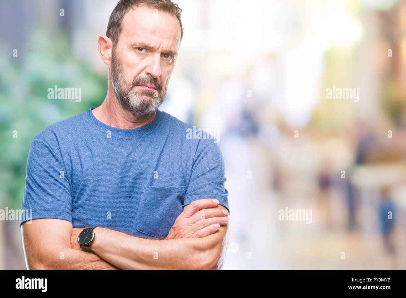Middle age hoary senior man over isolated background skeptic and ...