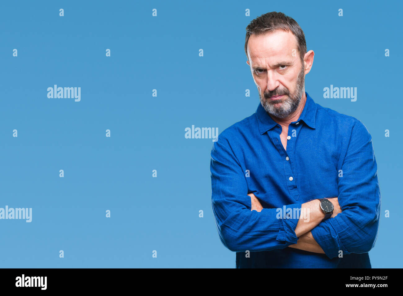 Middle age hoary senior man over isolated background skeptic and ...