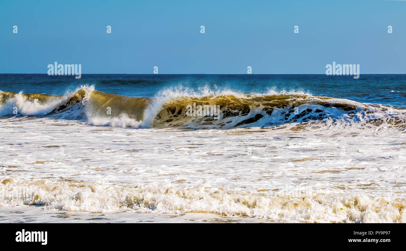 An atlantic wave breaks powerfully onto the shore Stock Photo - Alamy