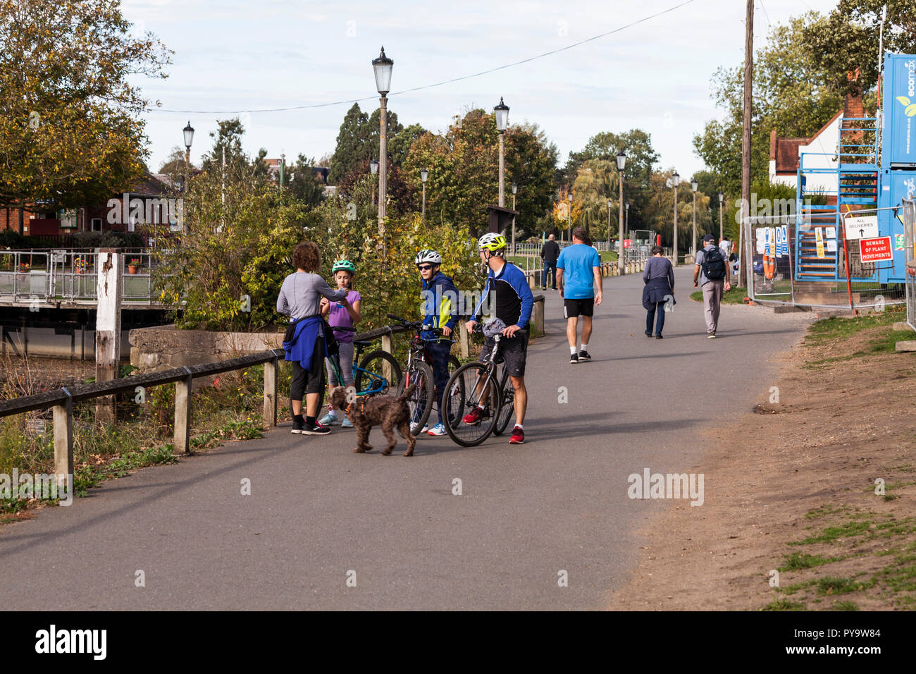 A family out for a cycle ride on the path at Teddington,London,England ...