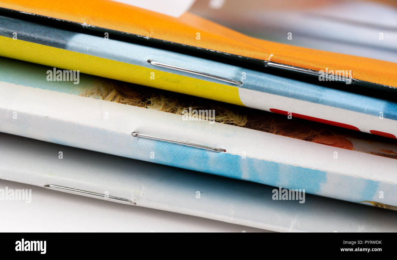 Stack of magazines in a fan viewed from the side Stock Photo - Alamy