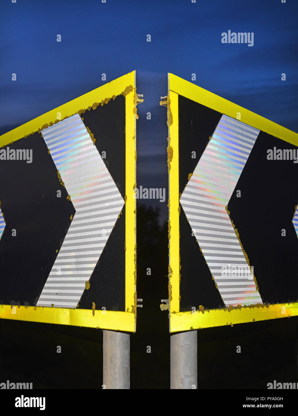 pattern on arrow symbols on sharp bend warning drivers on country road ...