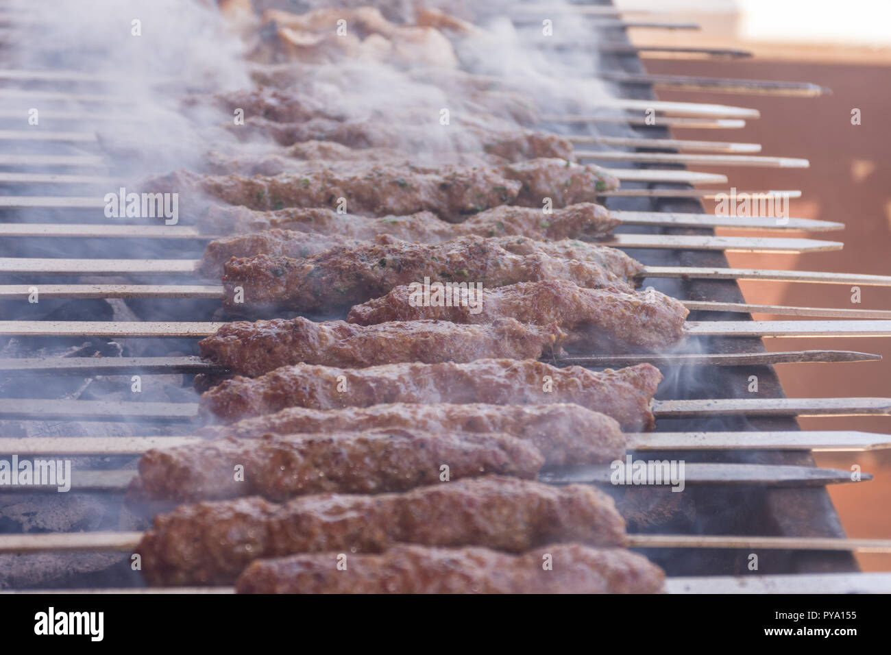 Closeup of kebab over hot charcoal barbecue Stock Photo - Alamy