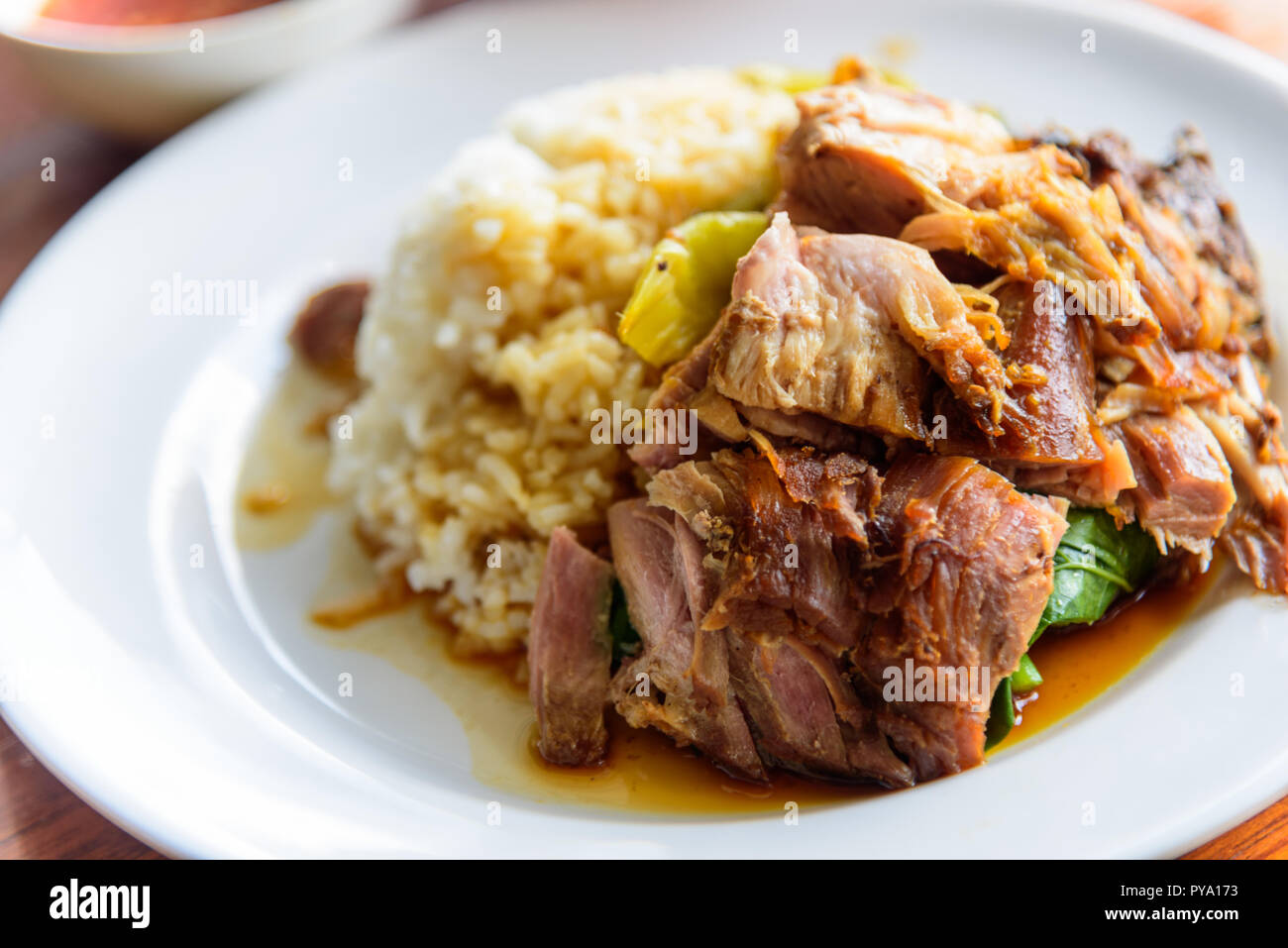 Stewed pork leg on rice Stock Photo - Alamy
